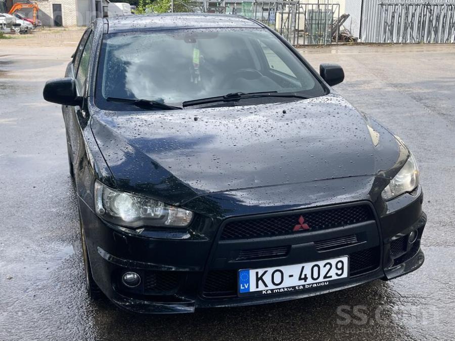Black Mitsubishi Lancer 2008 in Cesis, with an engine capacity of 1.80 L and mileage of 250 thousand km for 3150 €, photo 5 on AUTOMOTO.COM.LV