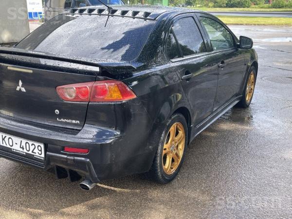 Black Mitsubishi Lancer 2008 in Cesis, with an engine capacity of 1.80 L and mileage of 250 thousand km for 3150 €, photo 5 on AUTOMOTO.COM.LV