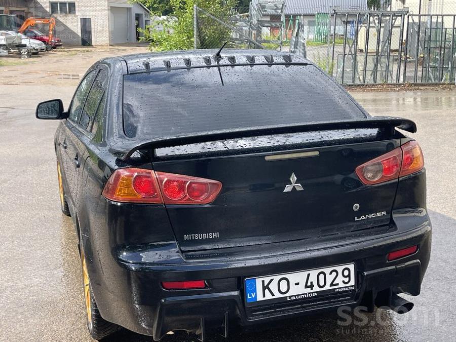Black Mitsubishi Lancer 2008 in Cesis, with an engine capacity of 1.80 L and mileage of 250 thousand km for 3150 €, photo 7 on AUTOMOTO.COM.LV