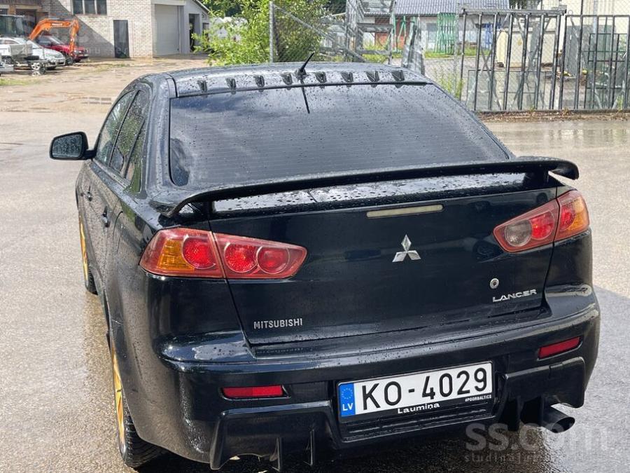 Black Mitsubishi Lancer 2008 in Cesis, with an engine capacity of 1.80 L and mileage of 250 thousand km for 3150 €, photo 8 on AUTOMOTO.COM.LV