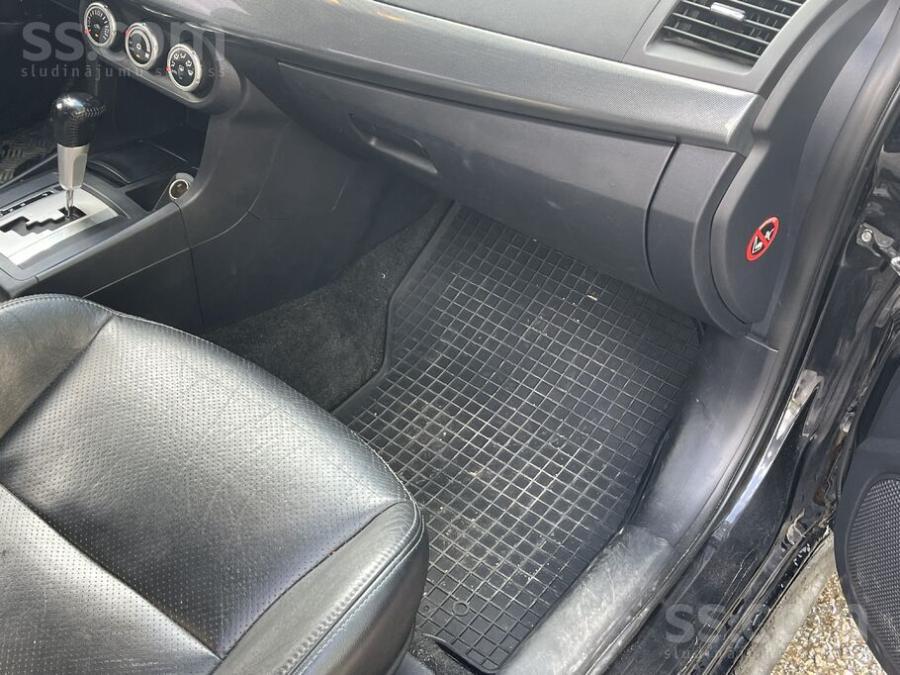 Black Mitsubishi Lancer 2008 in Cesis, with an engine capacity of 1.80 L and mileage of 250 thousand km for 3150 €, photo 10 on AUTOMOTO.COM.LV