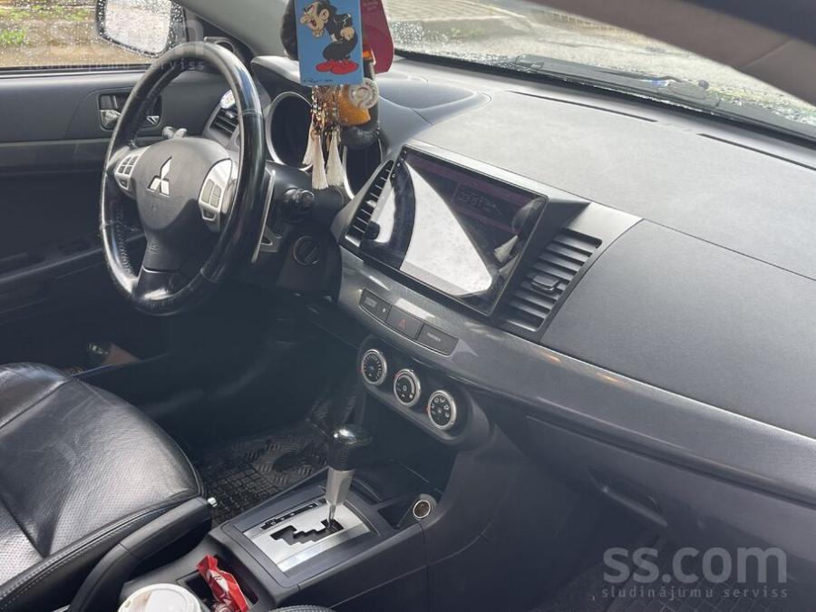 Black Mitsubishi Lancer 2008 in Cesis, with an engine capacity of 1.80 L and mileage of 250 thousand km for 3150 €, photo 11 on AUTOMOTO.COM.LV