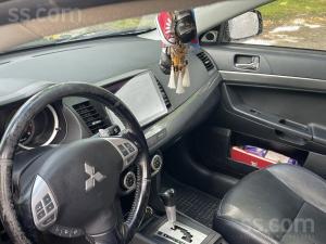 Black Mitsubishi Lancer 2008 in Cesis, with an engine capacity of 1.80 L and mileage of 250 thousand km for 3150 €, photo 12 on AUTOMOTO.COM.LV