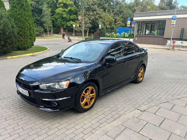 Black Mitsubishi Lancer 2008 in Vilnius, with an engine capacity of 1.80 L and mileage of 255 thousand km for 2950 €, photo 1 on AUTOMOTO.COM.LV