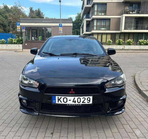Black Mitsubishi Lancer 2008 in Vilnius, with an engine capacity of 1.80 L and mileage of 255 thousand km for 2950 €, photo 2 on AUTOMOTO.COM.LV