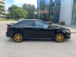 Black Mitsubishi Lancer 2008 in Vilnius, with an engine capacity of 1.80 L and mileage of 255 thousand km for 2950 €, photo 5 on AUTOMOTO.COM.LV