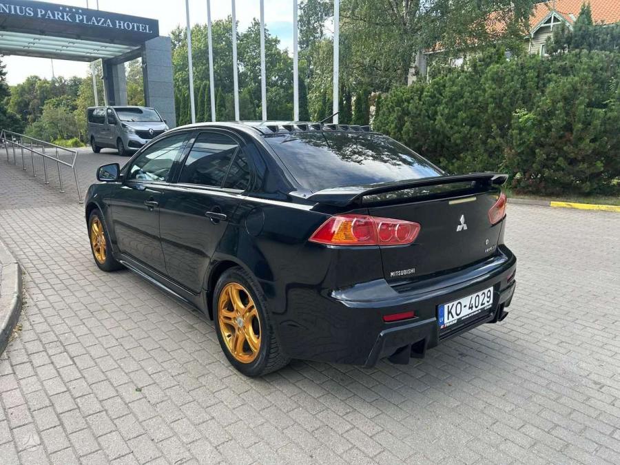 Black Mitsubishi Lancer 2008 in Vilnius, with an engine capacity of 1.80 L and mileage of 255 thousand km for 2950 €, photo 8 on AUTOMOTO.COM.LV