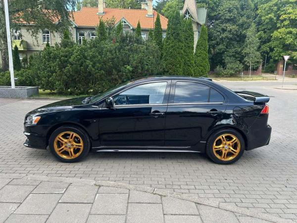 Black Mitsubishi Lancer 2008 in Vilnius, with an engine capacity of 1.80 L and mileage of 255 thousand km for 2950 €, photo 8 on AUTOMOTO.COM.LV