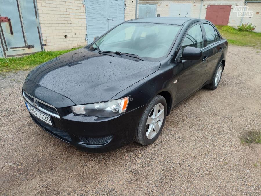 Black Mitsubishi Lancer 2008 in Utena, with an engine capacity of 2.00 L and mileage of 390 thousand km for 850 €, photo 3 on AUTOMOTO.COM.LV