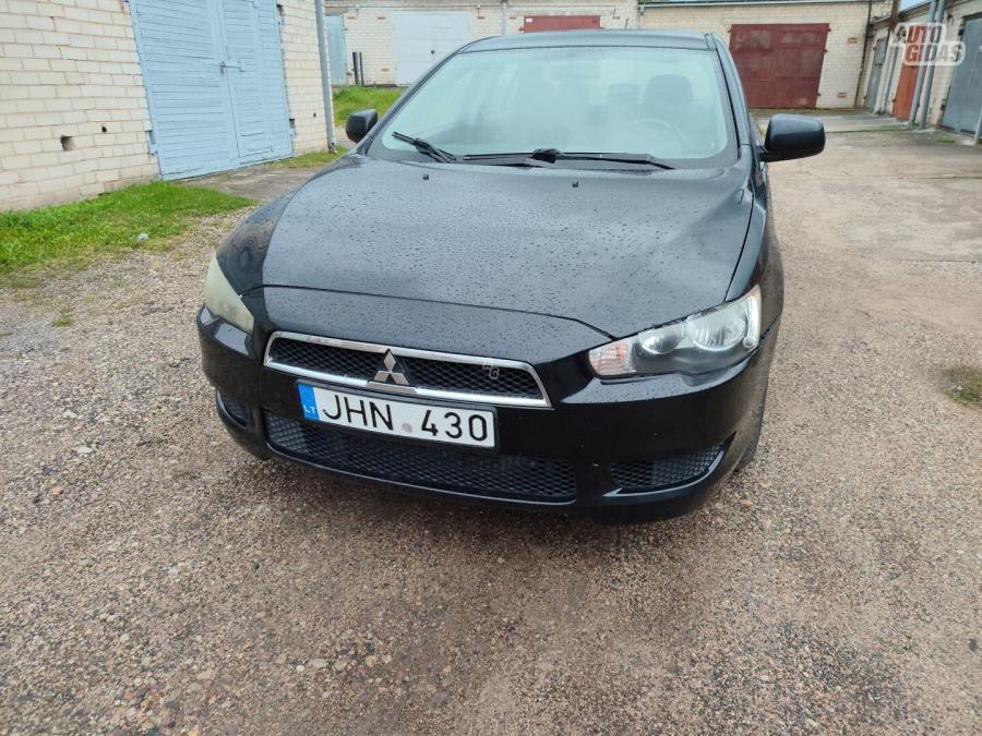 Black Mitsubishi Lancer 2008 in Utena, with an engine capacity of 2.00 L and mileage of 390 thousand km for 850 €, photo 4 on AUTOMOTO.COM.LV