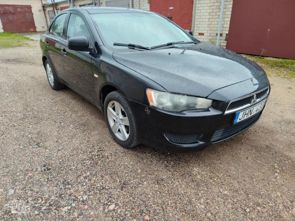 Mitsubishi Lancer 2008 in Utena on AUTOMOTO.COM.LV Black Mitsubishi Lancer 2008 in Utena, with an engine capacity of 2.00 L and mileage of 390 thousand km for 850 €, photo 5 on AUTOMOTO.COM.LV