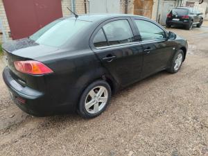 Black Mitsubishi Lancer 2008 in Utena, with an engine capacity of 2.00 L and mileage of 390 thousand km for 850 €, photo 7 on AUTOMOTO.COM.LV