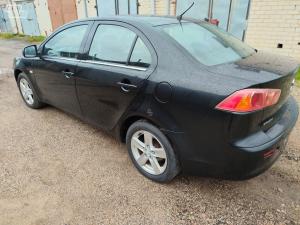 Black Mitsubishi Lancer 2008 in Utena, with an engine capacity of 2.00 L and mileage of 390 thousand km for 850 €, photo 9 on AUTOMOTO.COM.LV