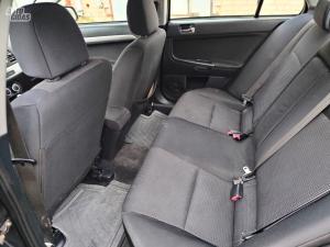 Black Mitsubishi Lancer 2008 in Utena, with an engine capacity of 2.00 L and mileage of 390 thousand km for 850 €, photo 13 on AUTOMOTO.COM.LV