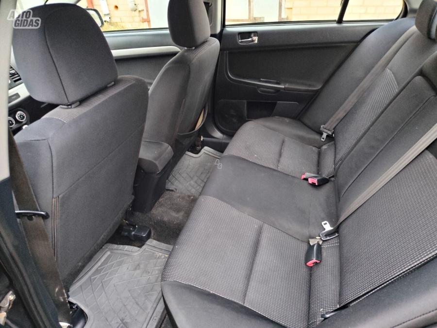 Black Mitsubishi Lancer 2008 in Utena, with an engine capacity of 2.00 L and mileage of 390 thousand km for 850 €, photo 13 on AUTOMOTO.COM.LV