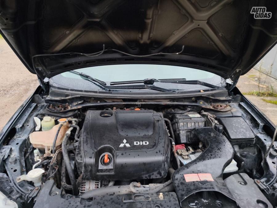 Black Mitsubishi Lancer 2008 in Utena, with an engine capacity of 2.00 L and mileage of 390 thousand km for 850 €, photo 14 on AUTOMOTO.COM.LV