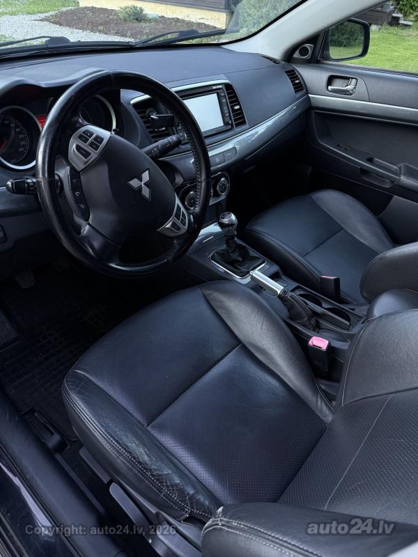 Melns Mitsubishi Lancer 2011 Tallina, ar dzinēja tilpumu 2.00 L un nobraukumu 231 tūkst. km par 5400 €, foto 6 vietnē AUTOMOTO.COM.LV