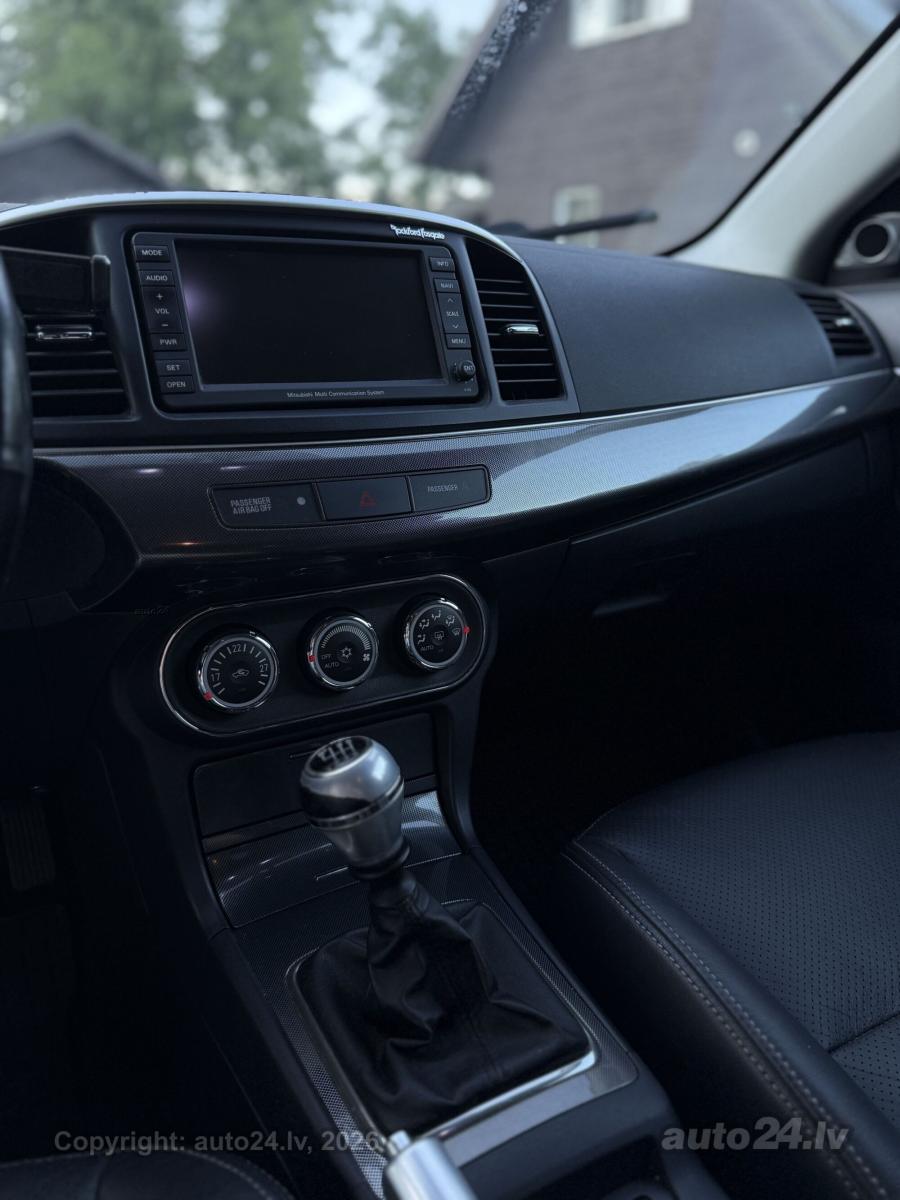 Melns Mitsubishi Lancer 2011 Tallina, ar dzinēja tilpumu 2.00 L un nobraukumu 231 tūkst. km par 5400 €, foto 9 vietnē AUTOMOTO.COM.LV