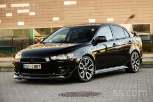 Black Mitsubishi Lancer 2012 in Jelgava, with an engine capacity of 1.80 L and mileage of 0 thousand km for 6450 €, photo 4 on AUTOMOTO.COM.LV