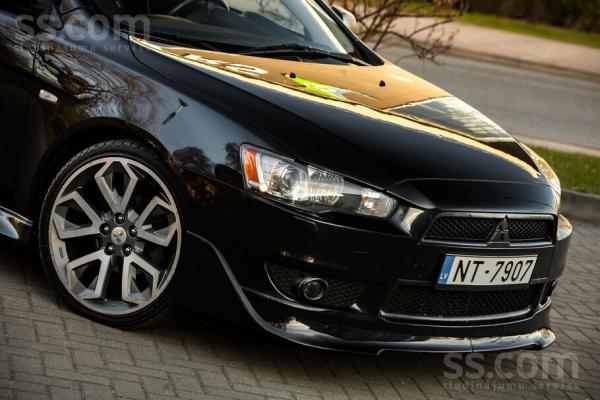 Black Mitsubishi Lancer 2012 in Jelgava, with an engine capacity of 1.80 L and mileage of 0 thousand km for 6450 €, photo 4 on AUTOMOTO.COM.LV
