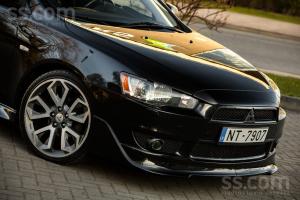 Black Mitsubishi Lancer 2012 in Jelgava, with an engine capacity of 1.80 L and mileage of 0 thousand km for 6450 €, photo 5 on AUTOMOTO.COM.LV