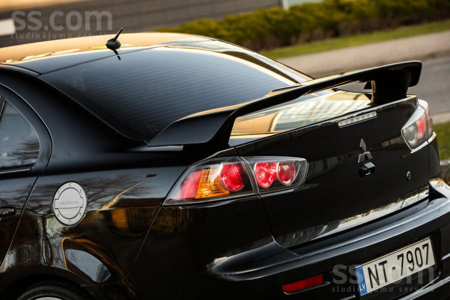 Black Mitsubishi Lancer 2012 in Jelgava, with an engine capacity of 1.80 L and mileage of 0 thousand km for 6450 €, photo 8 on AUTOMOTO.COM.LV