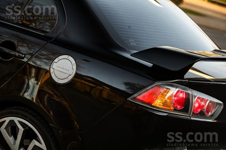 Black Mitsubishi Lancer 2012 in Jelgava, with an engine capacity of 1.80 L and mileage of 0 thousand km for 6450 €, photo 9 on AUTOMOTO.COM.LV