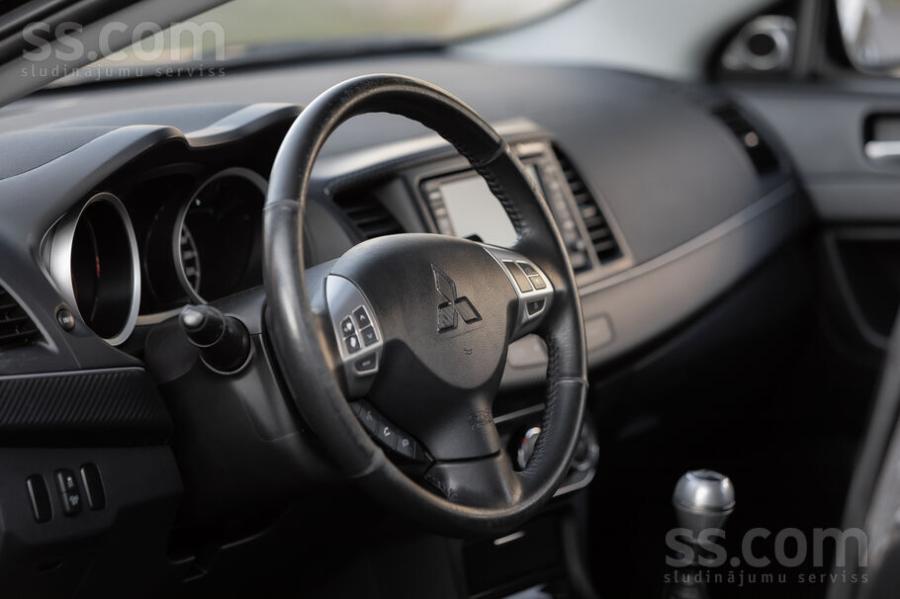 Black Mitsubishi Lancer 2012 in Jelgava, with an engine capacity of 1.80 L and mileage of 207 thousand km for 5900 €, photo 11 on AUTOMOTO.COM.LV