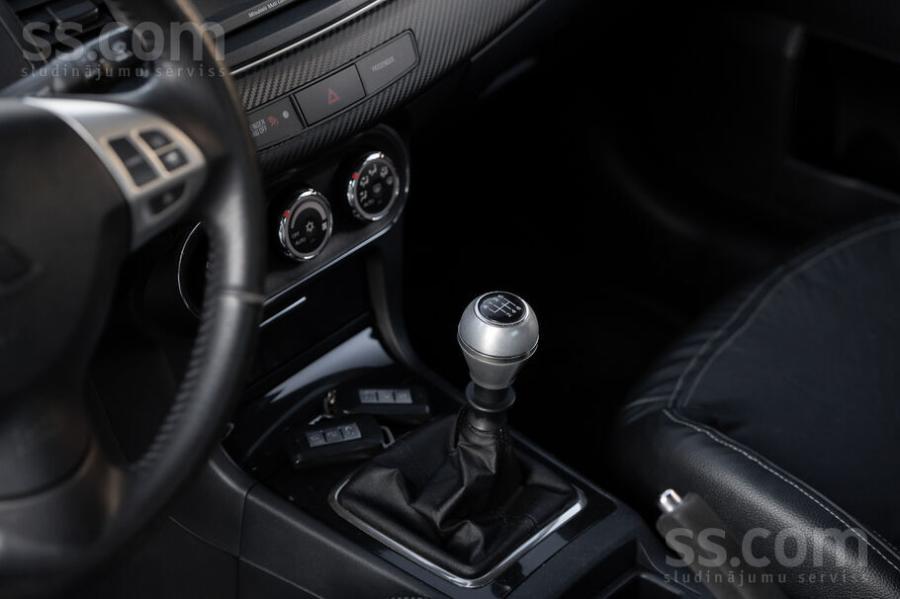 Black Mitsubishi Lancer 2012 in Jelgava, with an engine capacity of 1.80 L and mileage of 207 thousand km for 5900 €, photo 15 on AUTOMOTO.COM.LV