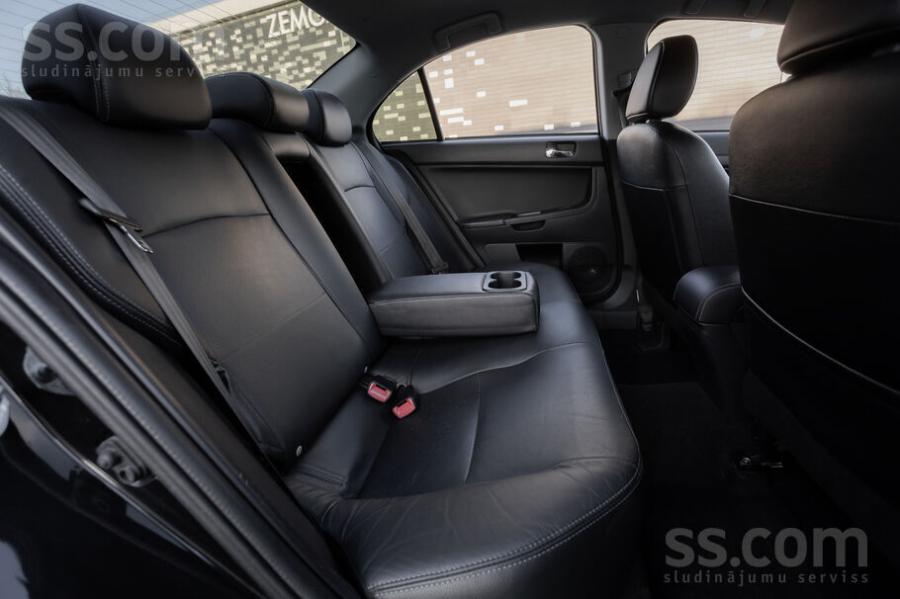 Black Mitsubishi Lancer 2012 in Jelgava, with an engine capacity of 1.80 L and mileage of 207 thousand km for 5900 €, photo 20 on AUTOMOTO.COM.LV