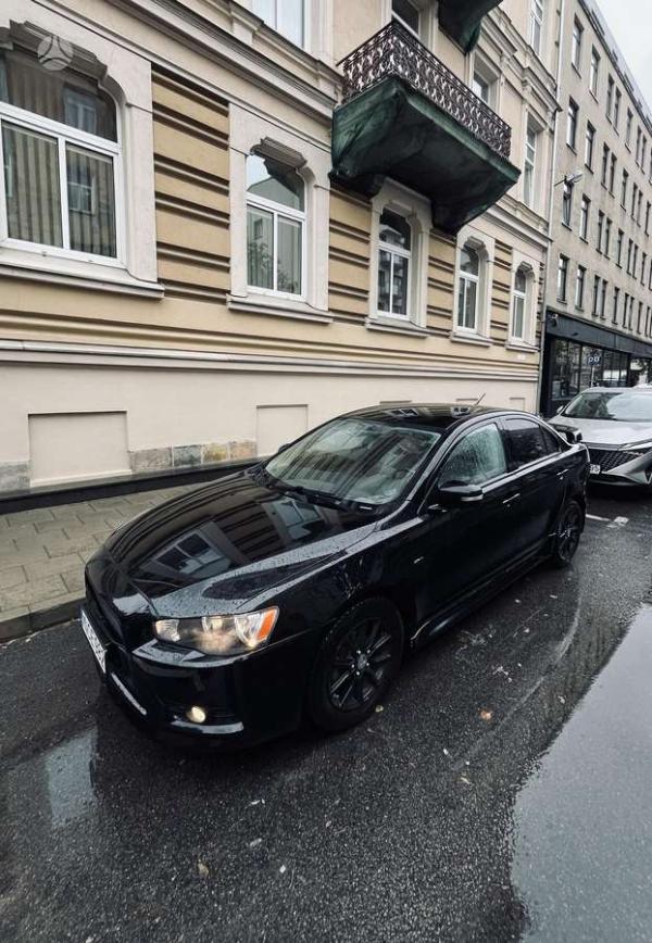Melns Mitsubishi Lancer 2017 Viļņa, ar dzinēja tilpumu 2.00 L un nobraukumu 114 tūkst. km par 5000 €, foto 4 vietnē AUTOMOTO.COM.LV