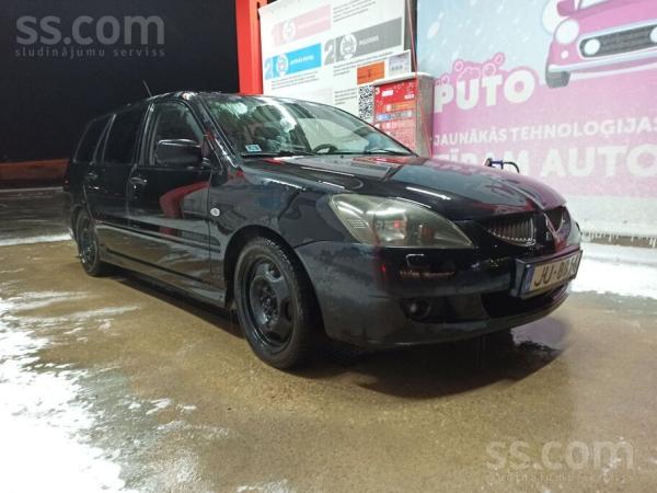 Black Mitsubishi Lancer 2003 in Riga, with an engine capacity of 2.00 L and mileage of 330 thousand km for 500 €, photo 4 on AUTOMOTO.COM.LV