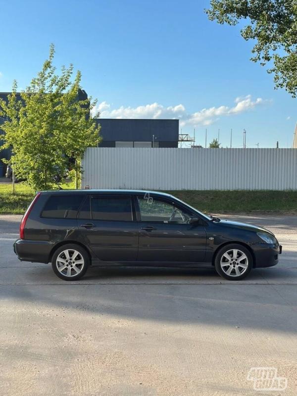 Black Mitsubishi Lancer 2004 in Alytus, with an engine capacity of 1.60 L and mileage of 390 thousand km for 1499 €, photo 3 on AUTOMOTO.COM.LV