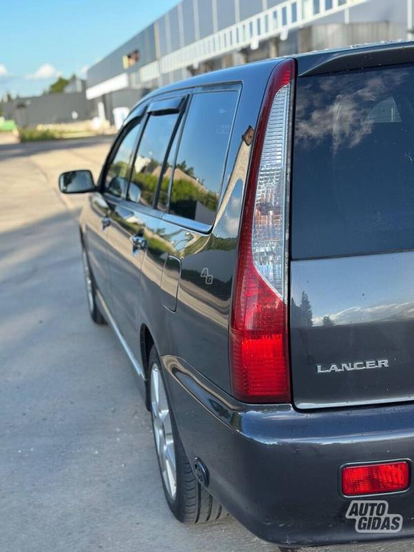 Black Mitsubishi Lancer 2004 in Alytus, with an engine capacity of 1.60 L and mileage of 390 thousand km for 1499 €, photo 6 on AUTOMOTO.COM.LV