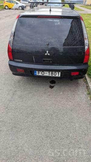 Black Mitsubishi Lancer 2005 in Riga, with an engine capacity of 2.00 L and mileage of 240 thousand km for 1000 €, photo  on AUTOMOTO.COM.LV