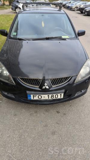 Melns Mitsubishi Lancer 2005 Rīga, ar dzinēja tilpumu 2.00 L un nobraukumu 240 tūkst. km par 1000 €, foto 4 vietnē AUTOMOTO.COM.LV