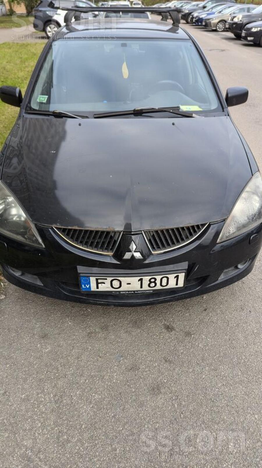Melns Mitsubishi Lancer 2005 Rīga, ar dzinēja tilpumu 2.00 L un nobraukumu 240 tūkst. km par 1000 €, foto 4 vietnē AUTOMOTO.COM.LV