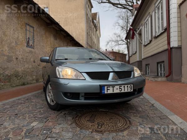 Blue Mitsubishi Lancer 2006 in Cesis, with an engine capacity of 1.60 L and mileage of 198 thousand km for 1290 €, photo 4 on AUTOMOTO.COM.LV