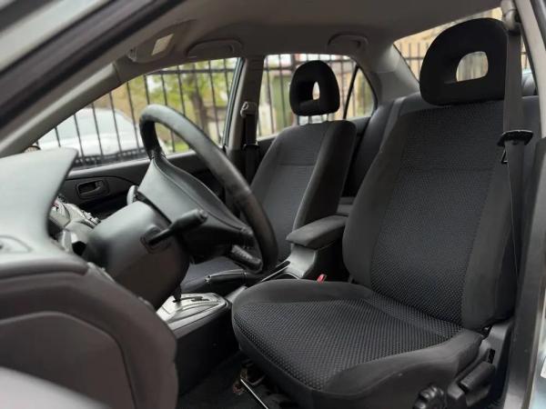 Blue Mitsubishi Lancer 2006 in Cesis, with an engine capacity of 1.60 L and mileage of 197 thousand km for 1790 €, photo 10 on AUTOMOTO.COM.LV