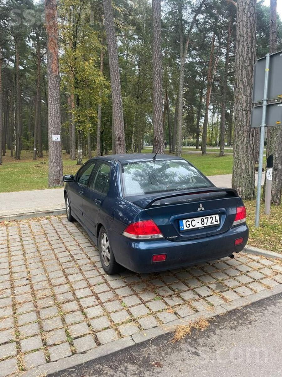 Blue Mitsubishi Lancer 2006 in Jurmala, with an engine capacity of 1.60 L and mileage of 185 thousand km for 500 €, photo 7 on AUTOMOTO.COM.LV
