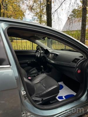 Blue Mitsubishi Lancer 2008 in Cesis, with an engine capacity of 2.00 L and mileage of 269 thousand km for 1999 €, photo 21 on AUTOMOTO.COM.LV