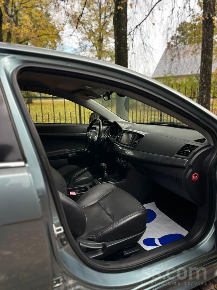 Blue Mitsubishi Lancer 2008 in Cesis, with an engine capacity of 2.00 L and mileage of 269 thousand km for 1999 €, photo 21 on AUTOMOTO.COM.LV