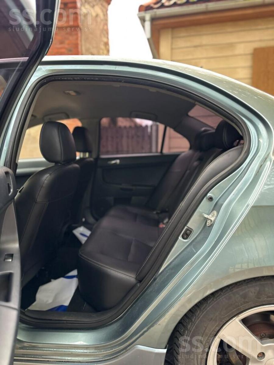 Blue Mitsubishi Lancer 2008 in Cesis, with an engine capacity of 2.00 L and mileage of 269 thousand km for 1999 €, photo 23 on AUTOMOTO.COM.LV