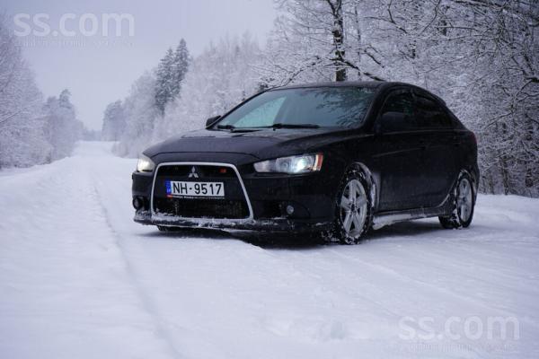 Black Mitsubishi lancer-evolution 2011 in Riga, with an engine capacity of 2.00 L and mileage of 236 thousand km for 7700 €, photo 2 on AUTOMOTO.COM.LV