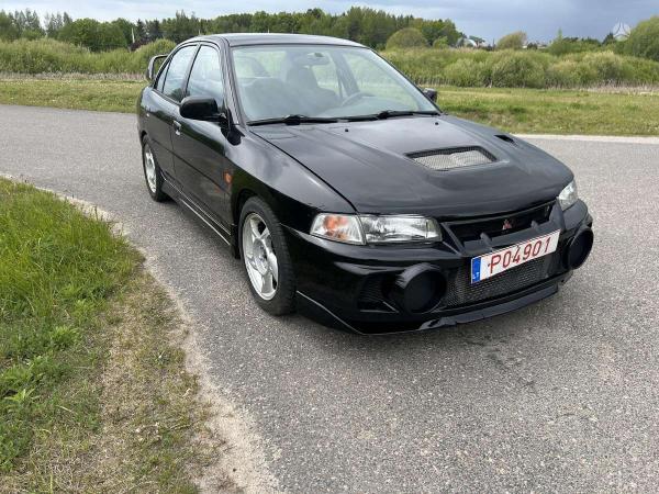 Melns Mitsubishi lancer-evolution 1996 Alīta, ar dzinēja tilpumu 2.00 L un nobraukumu 170 tūkst. km par 14200 €, foto 1 vietnē AUTOMOTO.COM.LV