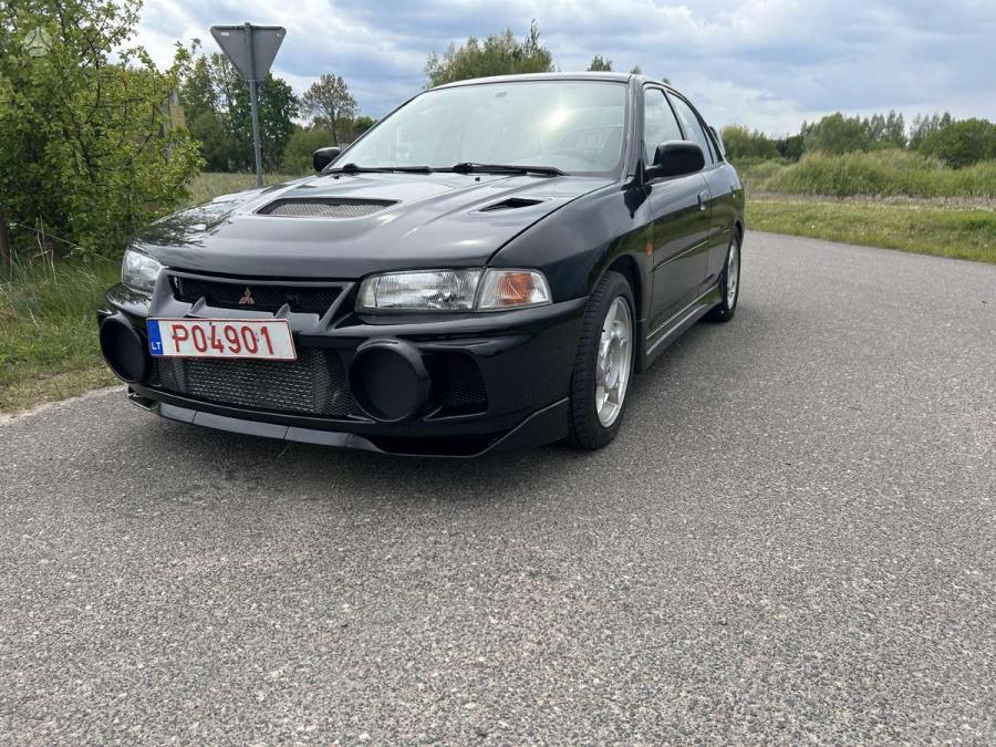 Black Mitsubishi lancer-evolution 1996 in Alytus, with an engine capacity of 2.00 L and mileage of 170 thousand km for 14200 €, photo 2 on AUTOMOTO.COM.LV