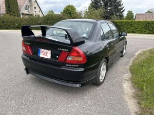Black Mitsubishi lancer-evolution 1996 in Alytus, with an engine capacity of 2.00 L and mileage of 170 thousand km for 14200 €, photo 3 on AUTOMOTO.COM.LV