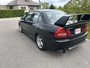 Black Mitsubishi lancer-evolution 1996 in Alytus, with an engine capacity of 2.00 L and mileage of 170 thousand km for 14200 €, photo 4 on AUTOMOTO.COM.LV