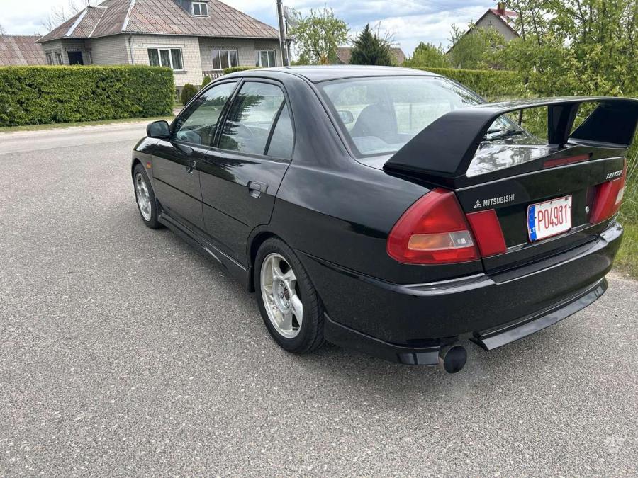 Black Mitsubishi lancer-evolution 1996 in Alytus, with an engine capacity of 2.00 L and mileage of 170 thousand km for 14200 €, photo 4 on AUTOMOTO.COM.LV