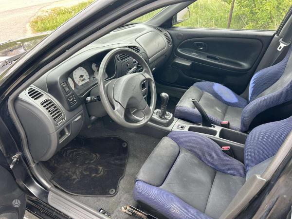 Melns Mitsubishi lancer-evolution 1996 Alīta, ar dzinēja tilpumu 2.00 L un nobraukumu 170 tūkst. km par 14200 €, foto 6 vietnē AUTOMOTO.COM.LV